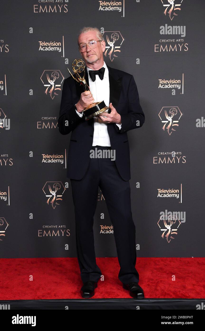 Hamish Hamilton poses in the press room with the award for outstanding ...