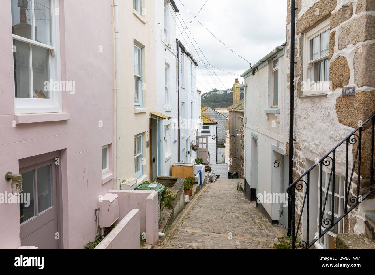St Ives Cornwall, cobbled narrow street between homes and cottages in ...