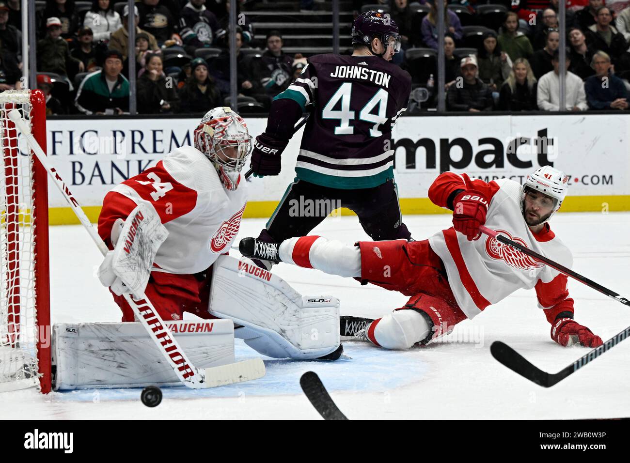 Detroit Red Wings goaltender Alex Lyon (34) deflects a shot with ...