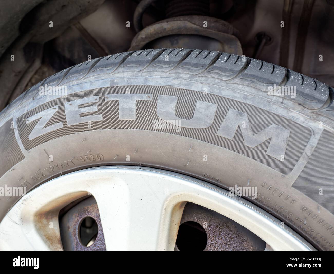 Black Zetum car tyre on rusted steel wheel. Auckland, New Zealand ...
