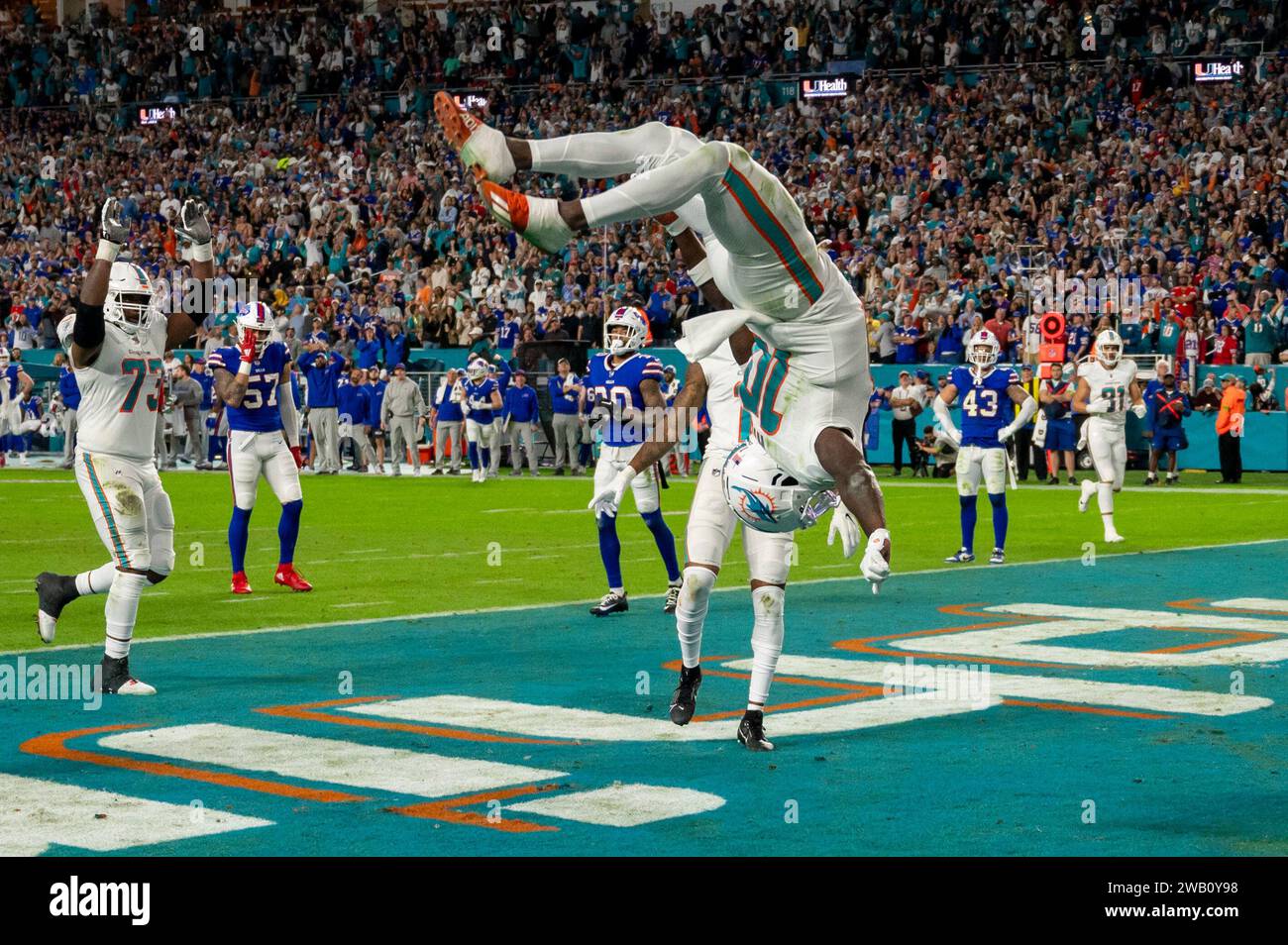 Miami Dolphins wide receiver Tyreek Hill (10) does a back flip in the ...