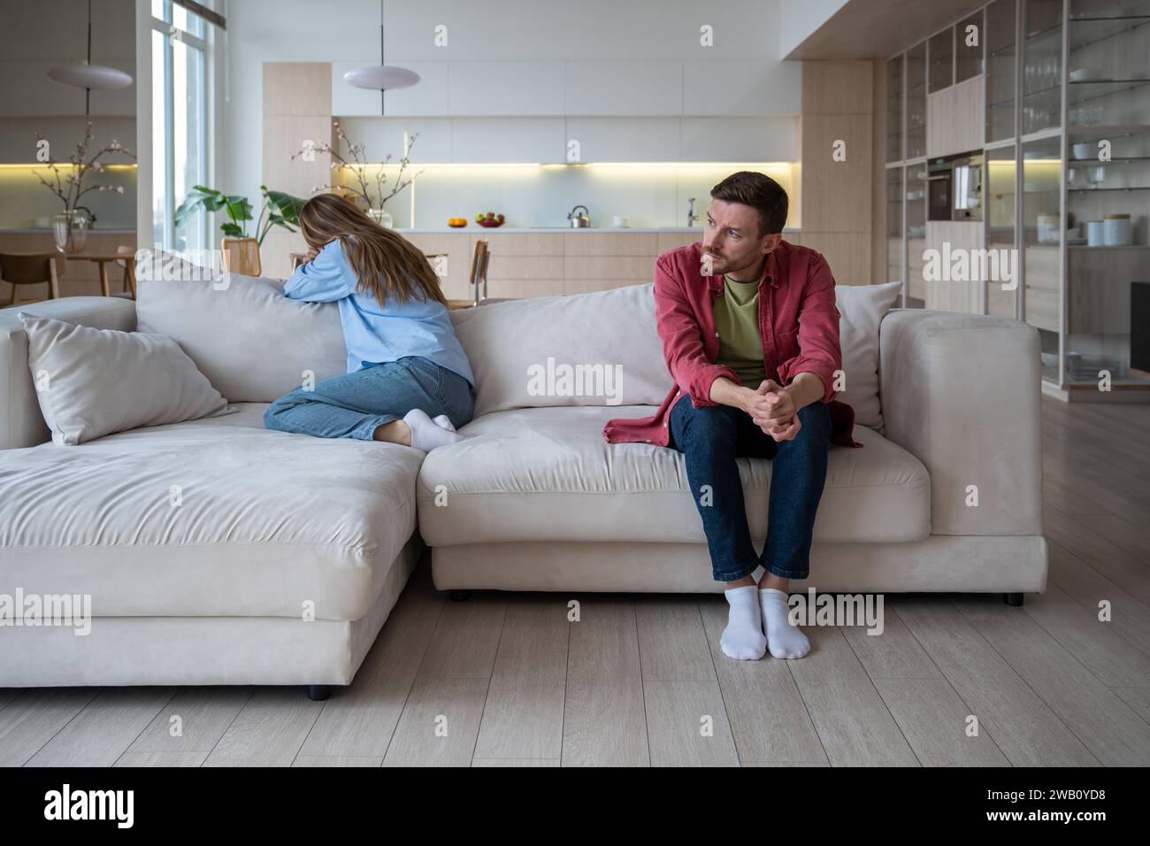 Desperate wife crying, thinking of divorce, and unhappy sad husband ...