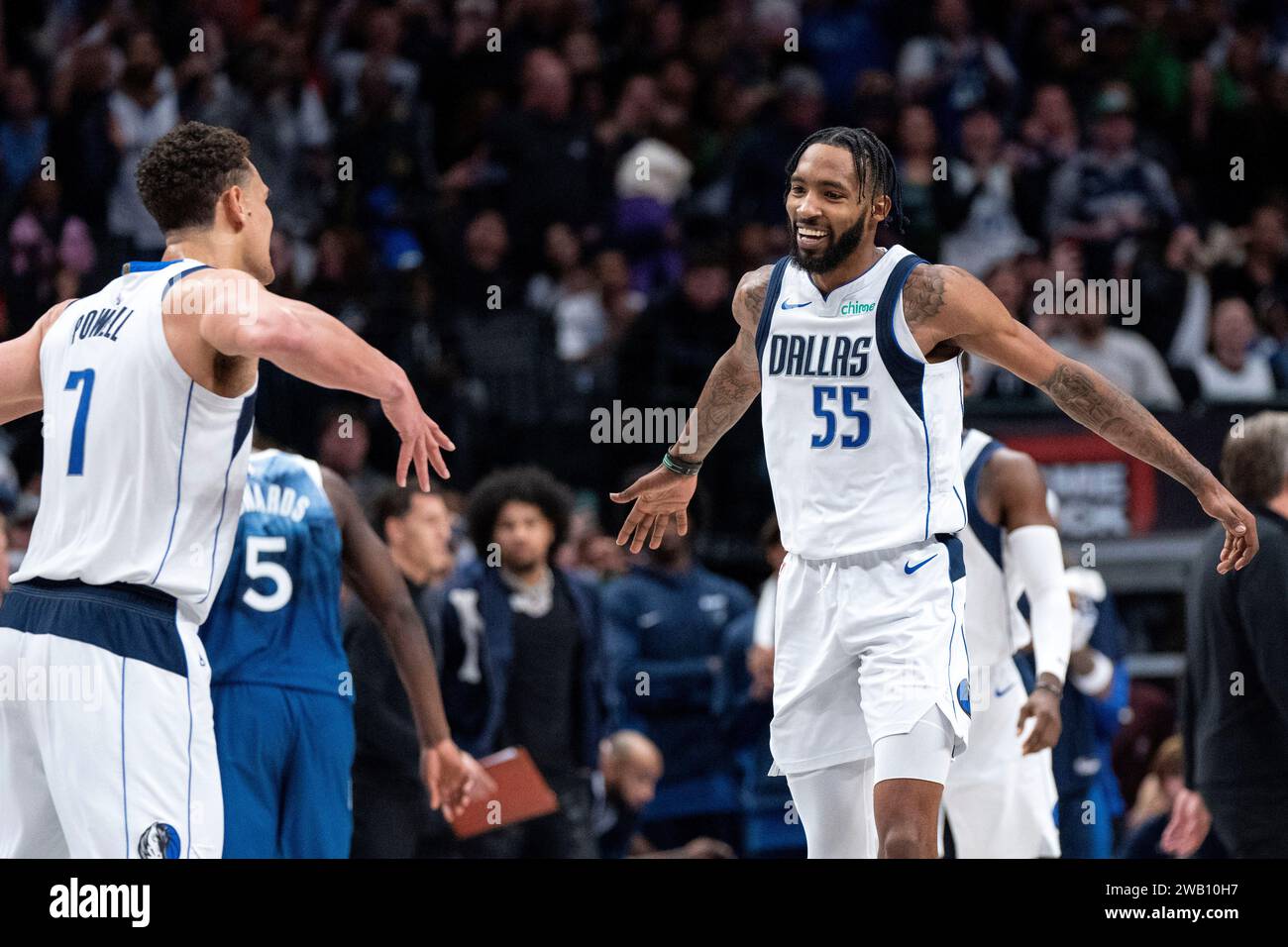 Dallas Mavericks forward Derrick Jones Jr. (55) celebrates with center ...