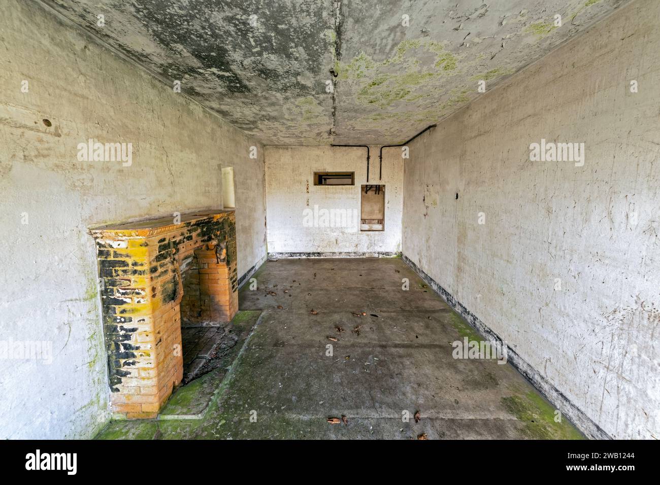 Room with a fireplace in an abandoned military bunker Stock Photo - Alamy