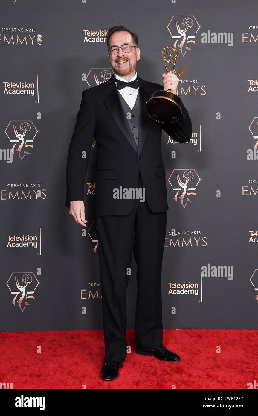 Nik Ranieri poses in the press room with the award for outstanding ...