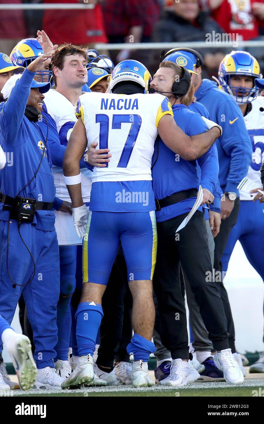 Los Angeles Rams wide receiver Puka Nacua (17) is congratulated by head ...