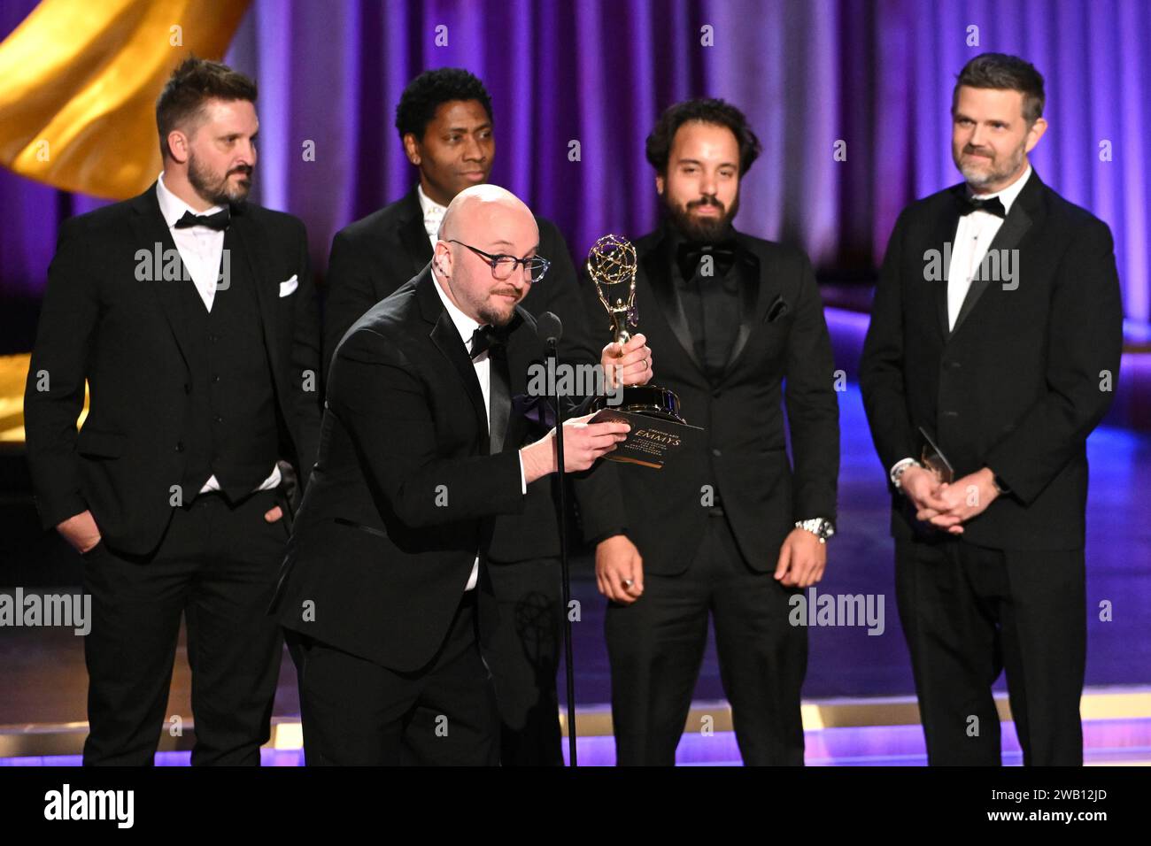 The team from "Welcome To Wrexham - Do or Die" accepts the Emmy for ...