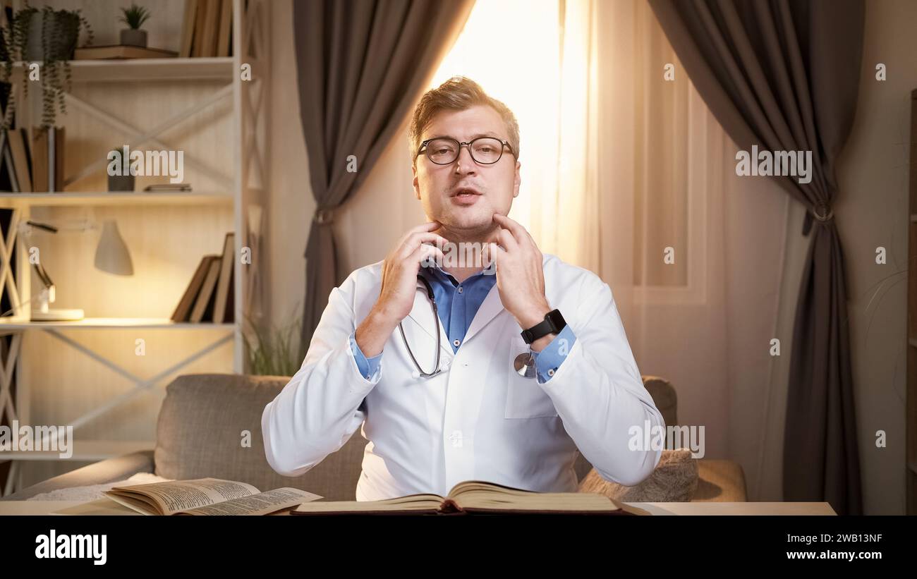 Medical checkup clinic doctor man palpating video Stock Photo - Alamy