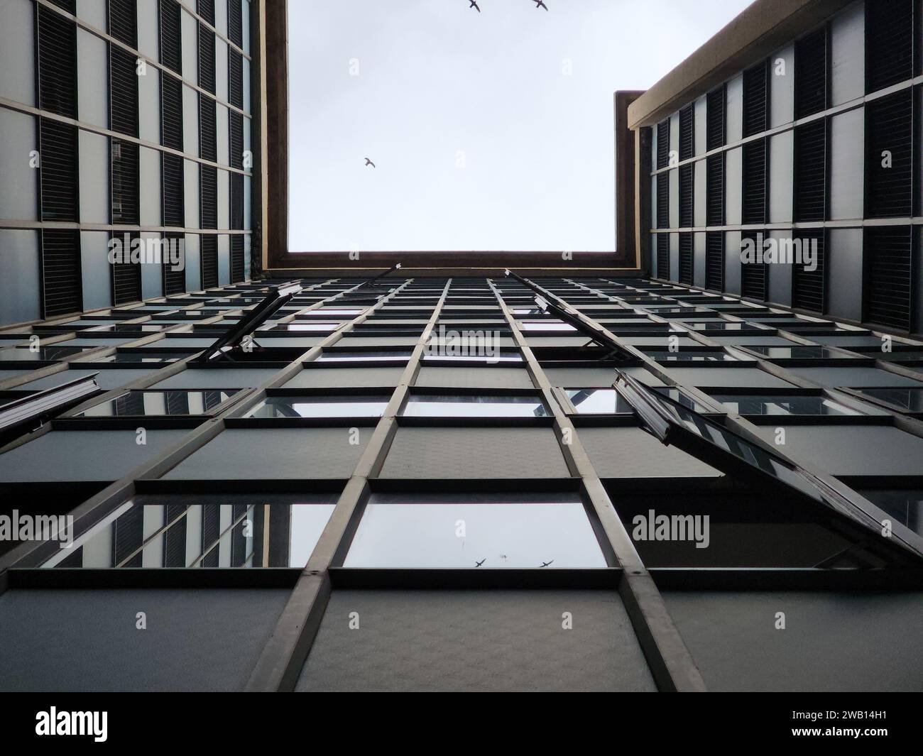 A shot of a multistory building from its ground floor Stock Photo - Alamy