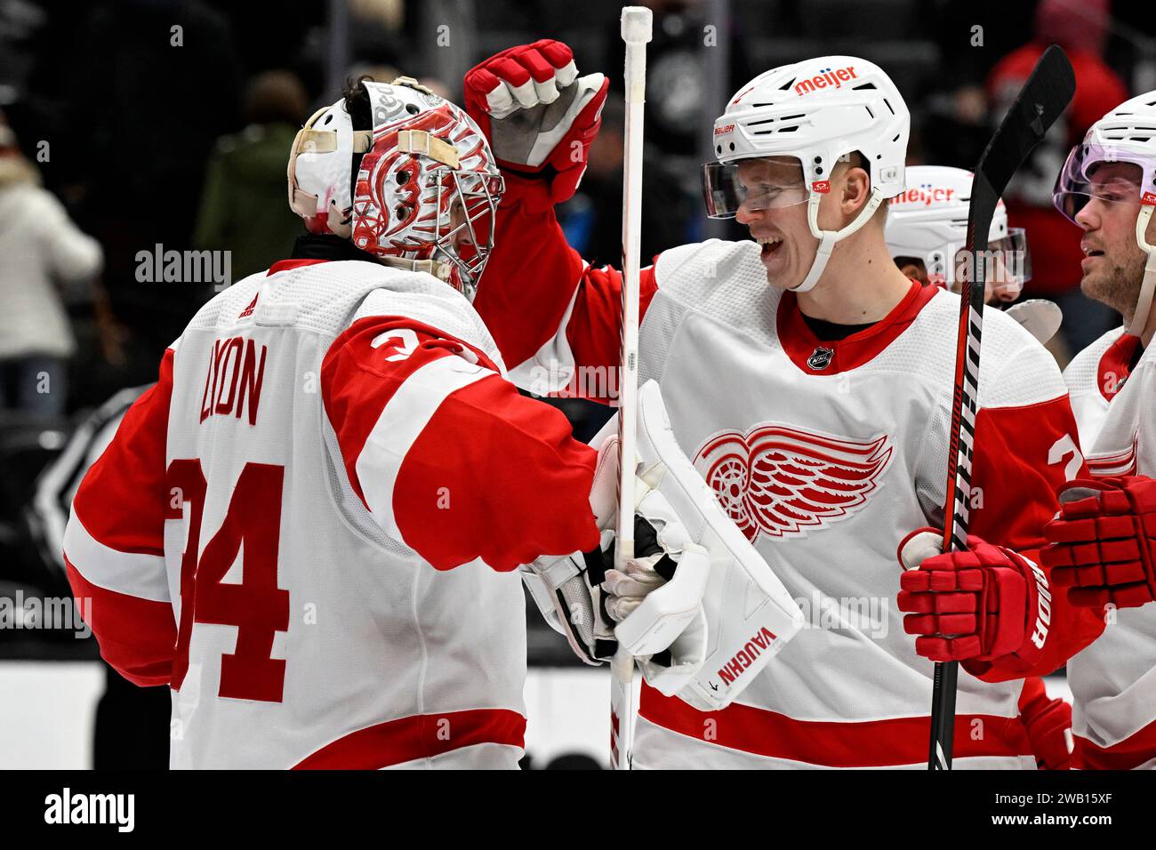 Detroit Red Wings goaltender Alex Lyon (34) celebrates with defenseman ...