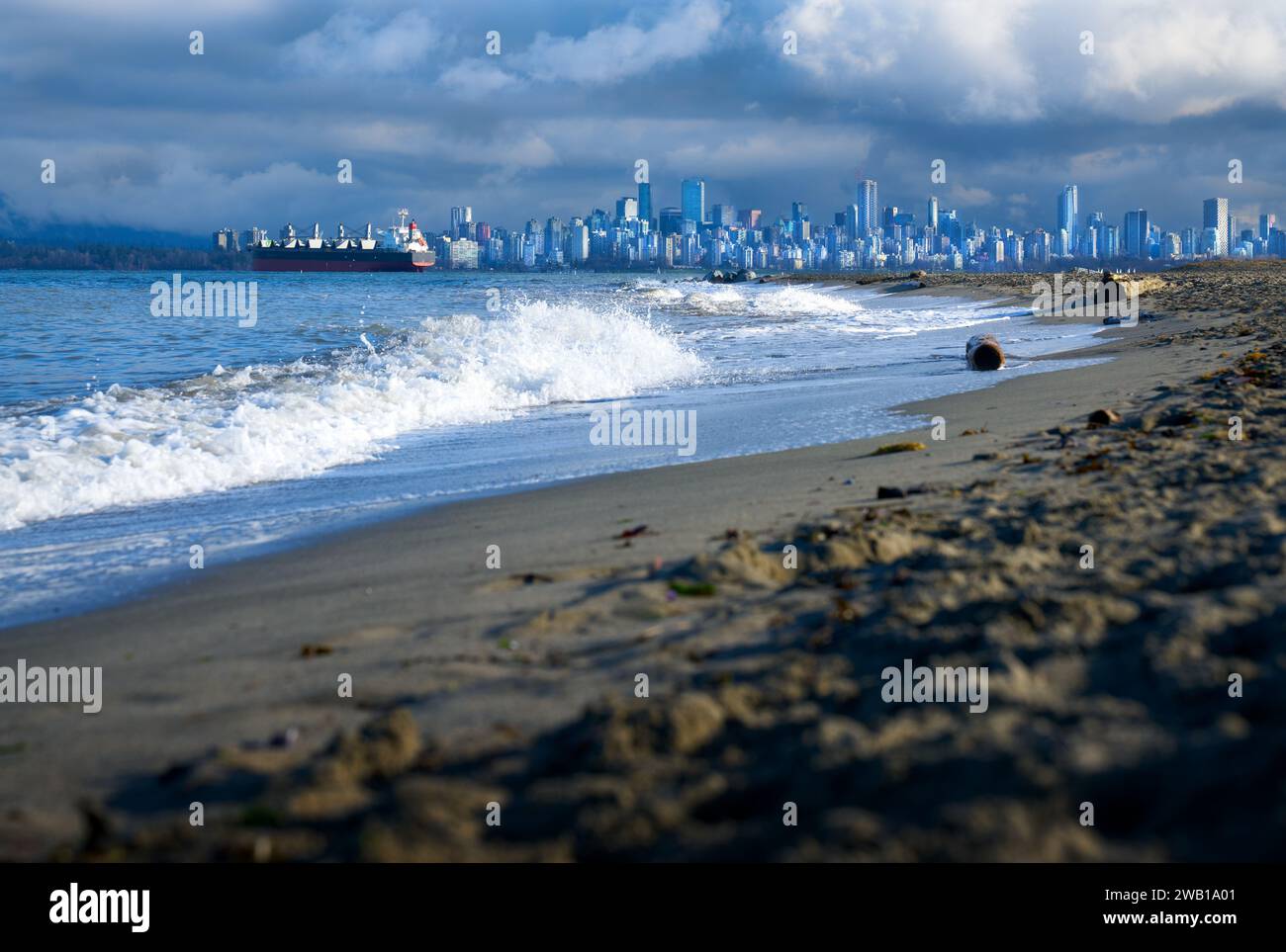 English Bay Waves Vancouver Skyline. Ocean wave breaking on Spanish ...
