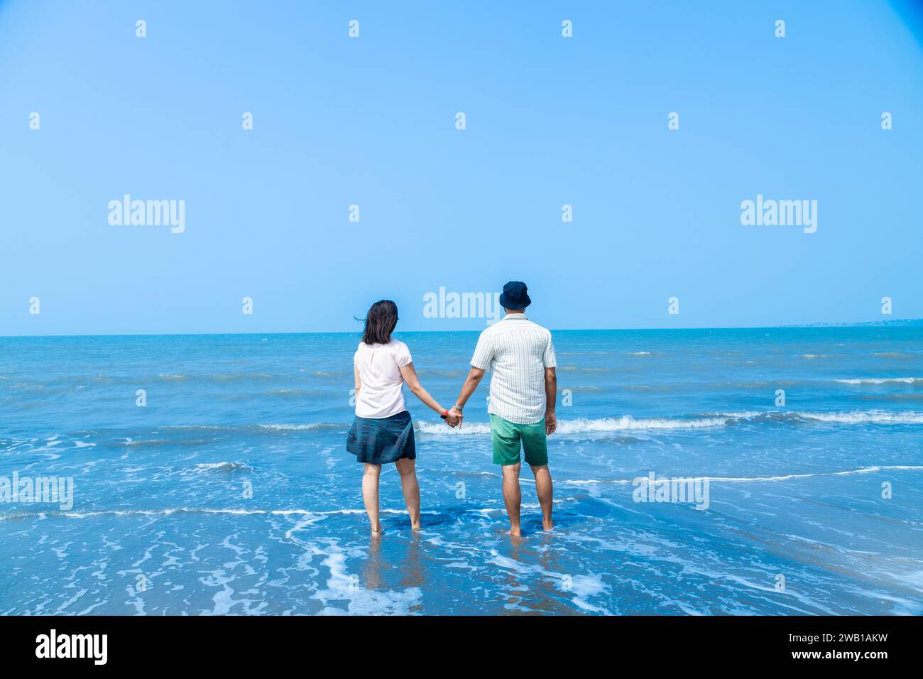 Indian couple holding hands hi-res stock photography and images - Alamy
