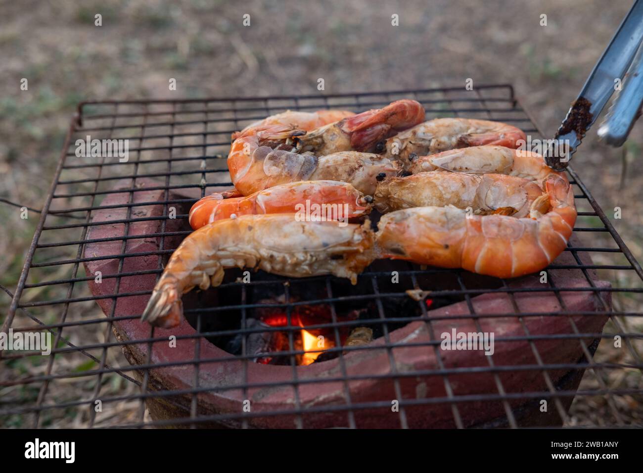 Grilled river prawns on a charcoal grill Stock Photo - Alamy