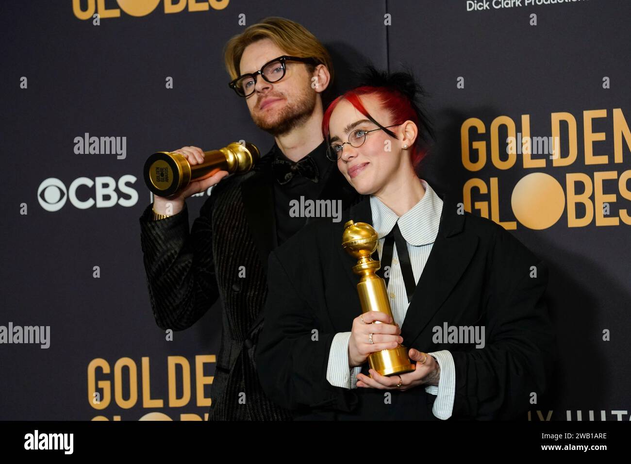 Finneas, left, and Billie Eilish pose in the press room with the award ...