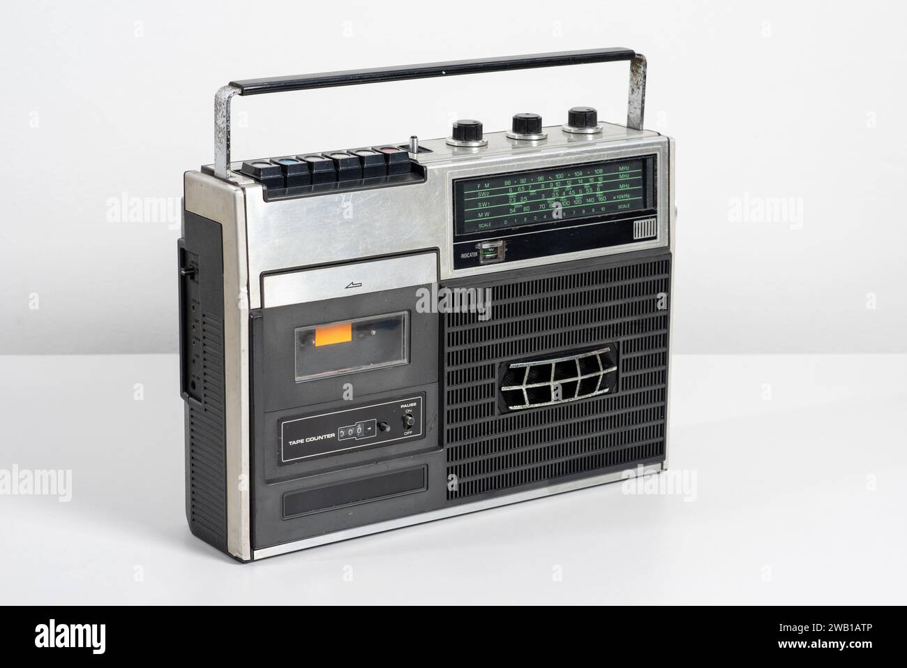 Vintage portable radio with cassette tape player over white background ...