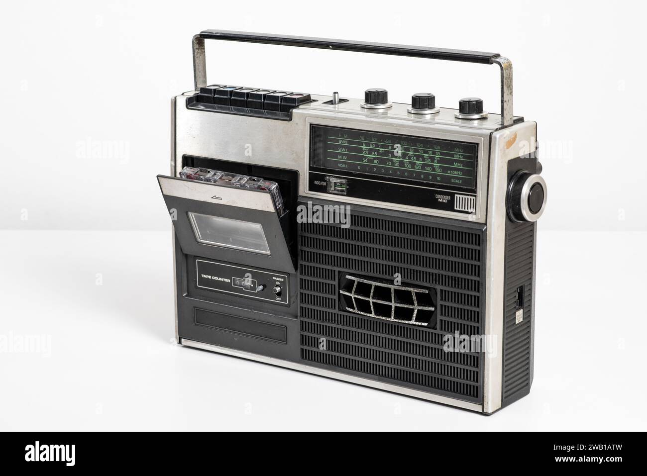 Vintage portable radio with cassette tape player over white background ...