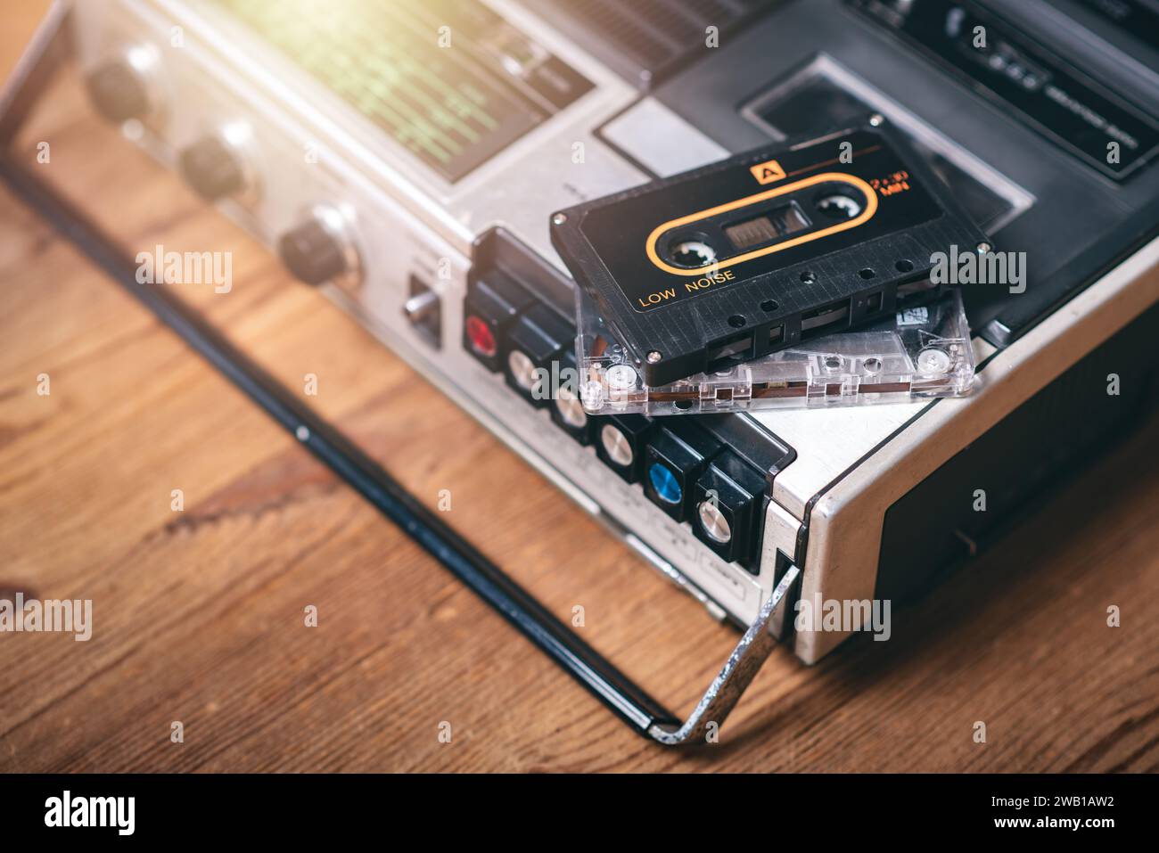 Vintage portable radio with cassette tape player on the wooden table ...