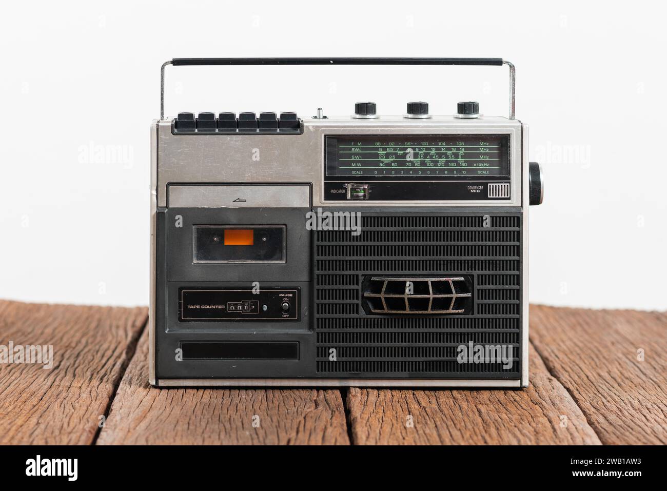 Vintage portable radio with cassette tape player on the wooden table ...
