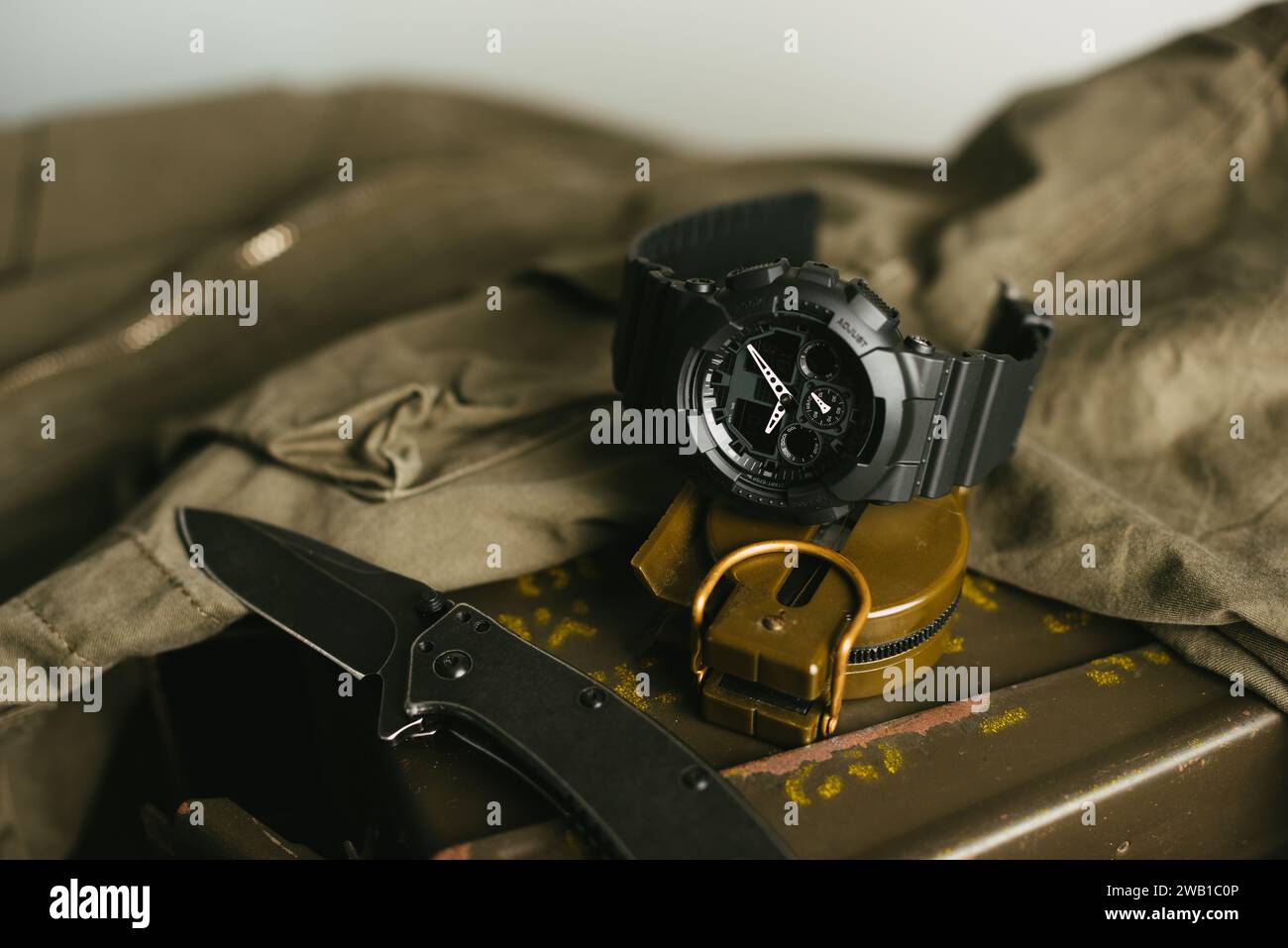 Close up black analog-digital hybrid wristwatch. Military style men ...