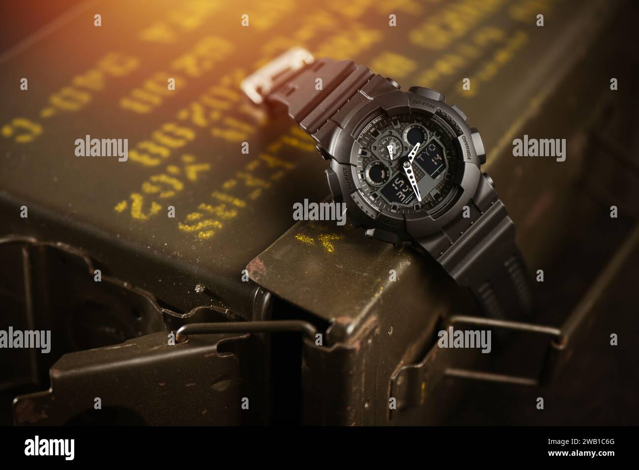 Close up black analog-digital hybrid wristwatch. Military style men ...
