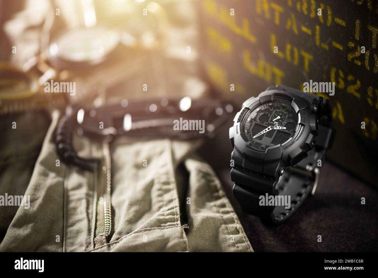 Close up black analog-digital hybrid wristwatch. Military style men ...