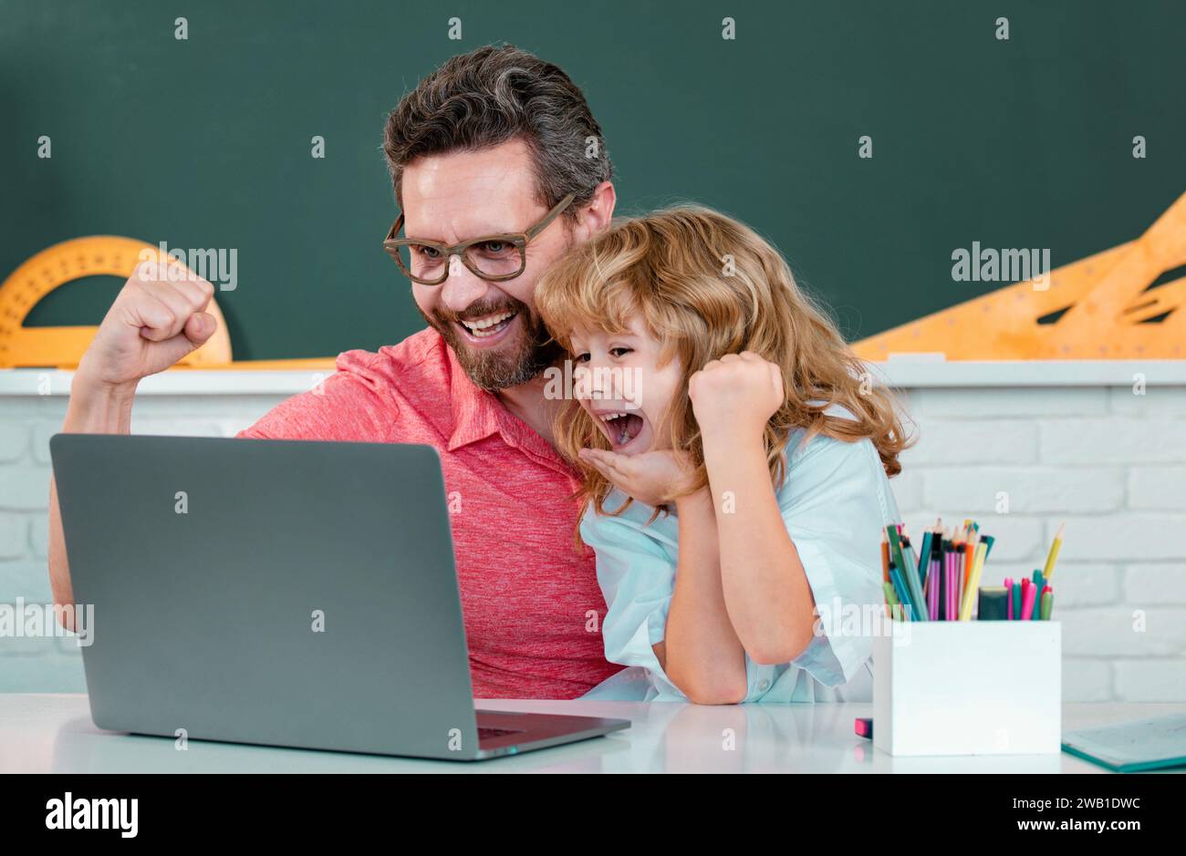Pupil kid student and teacher tutor in classroom at school lesson ...