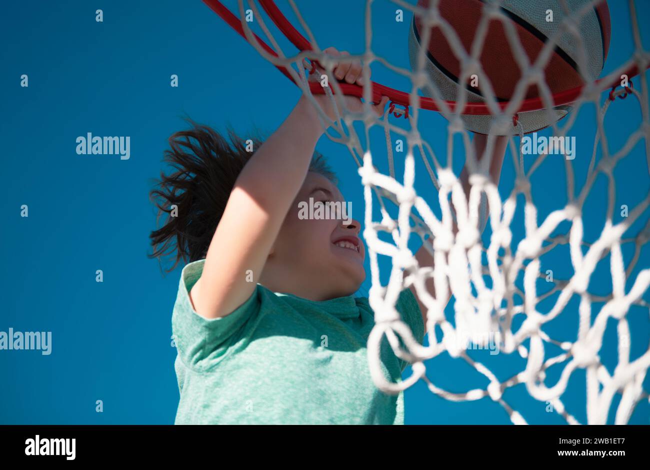 Basketball kids game. Cute little child boy holding a basket ball ...