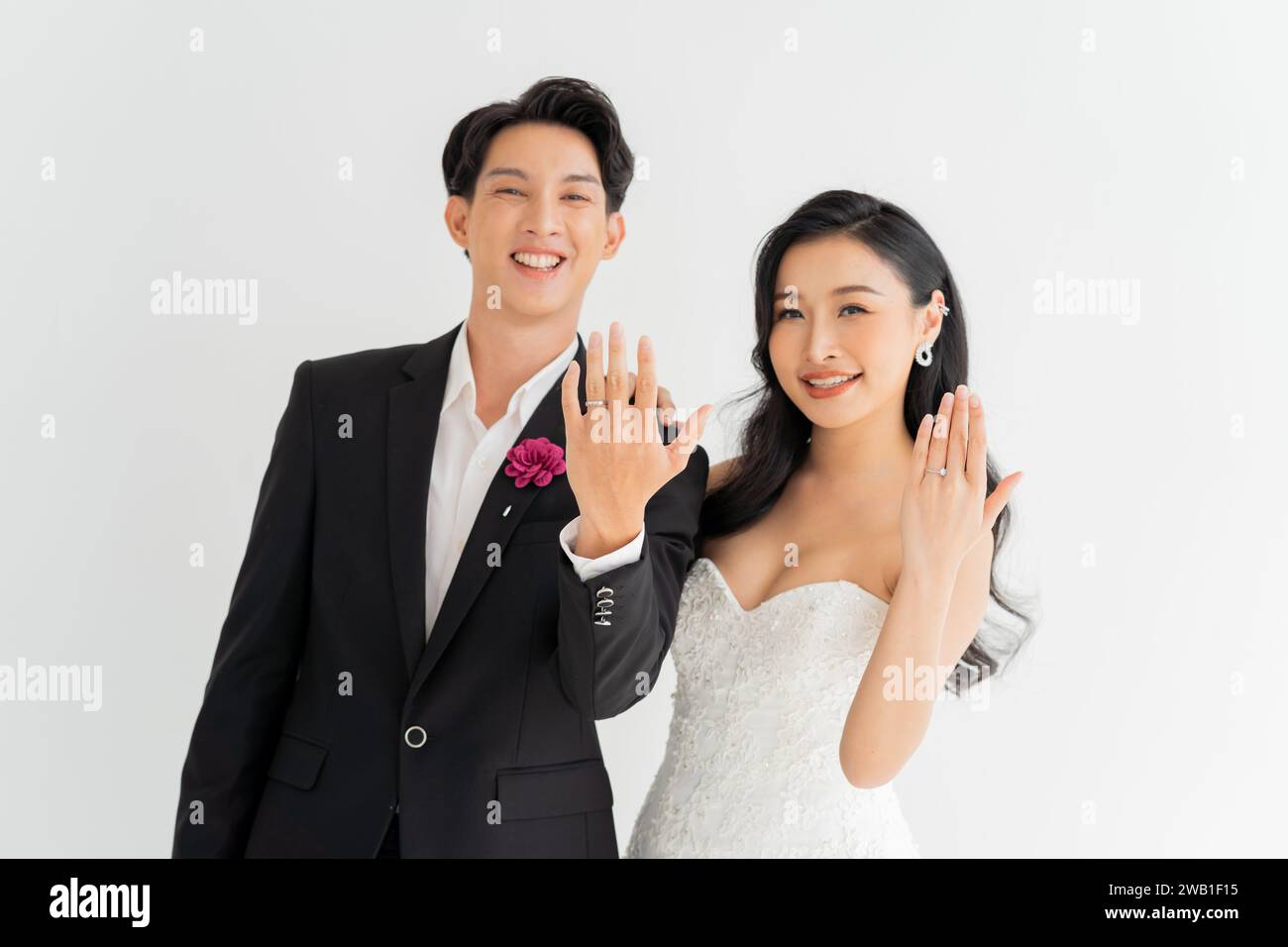 Love and commitment reflected in the smiles of an Asian couple as they ...
