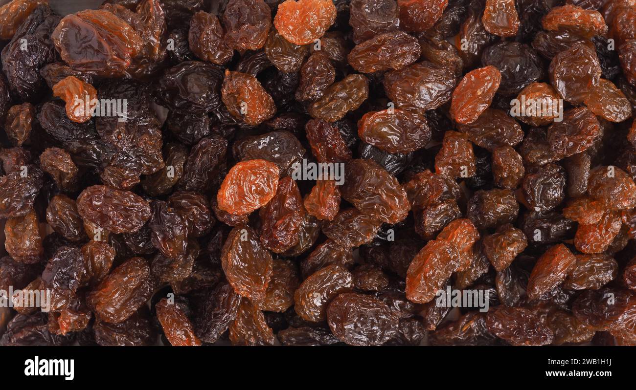 Tasty organic raisins, close up, texture image using as background or ...