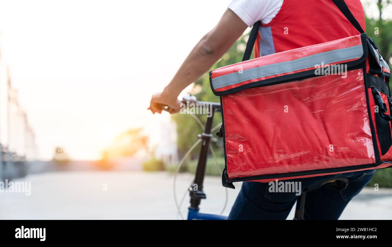 Food delivery man on bicycle, ready for work Stock Photo - Alamy