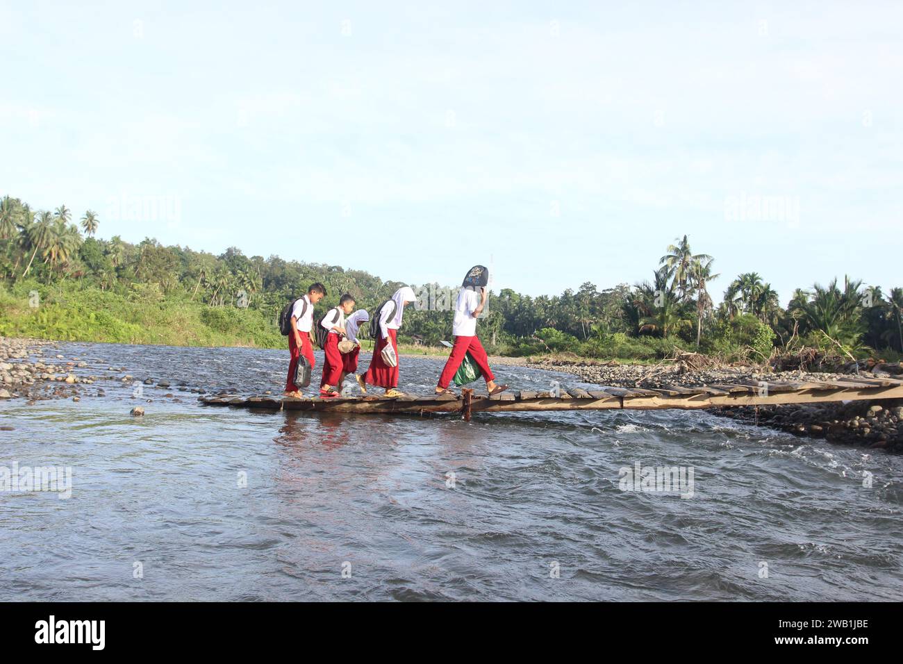 The portrait of students in Indonesia walking one kilometer to get to ...