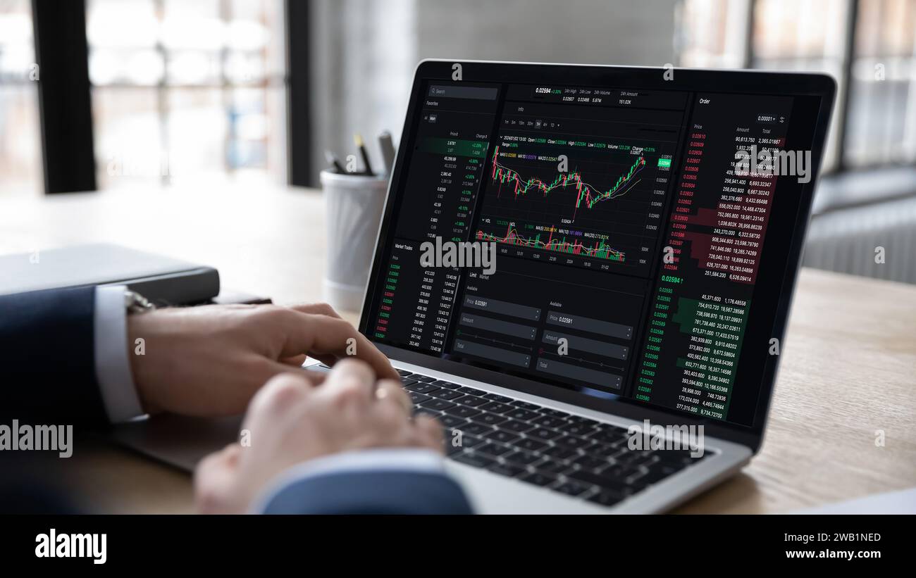 Trader check market stock, makes analysis of long-term investments ...