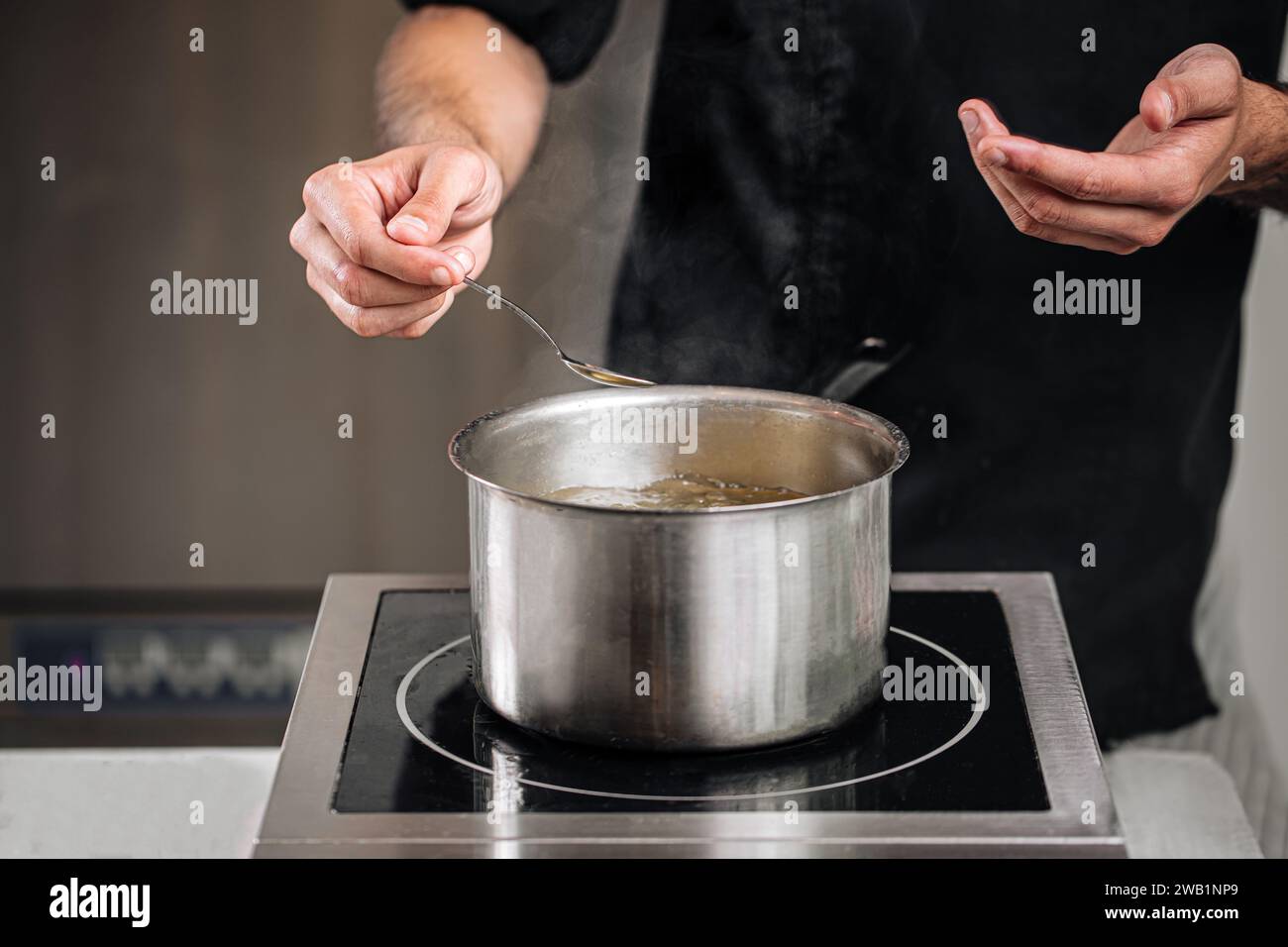 Chef boiling water in hi-res stock photography and images - Alamy