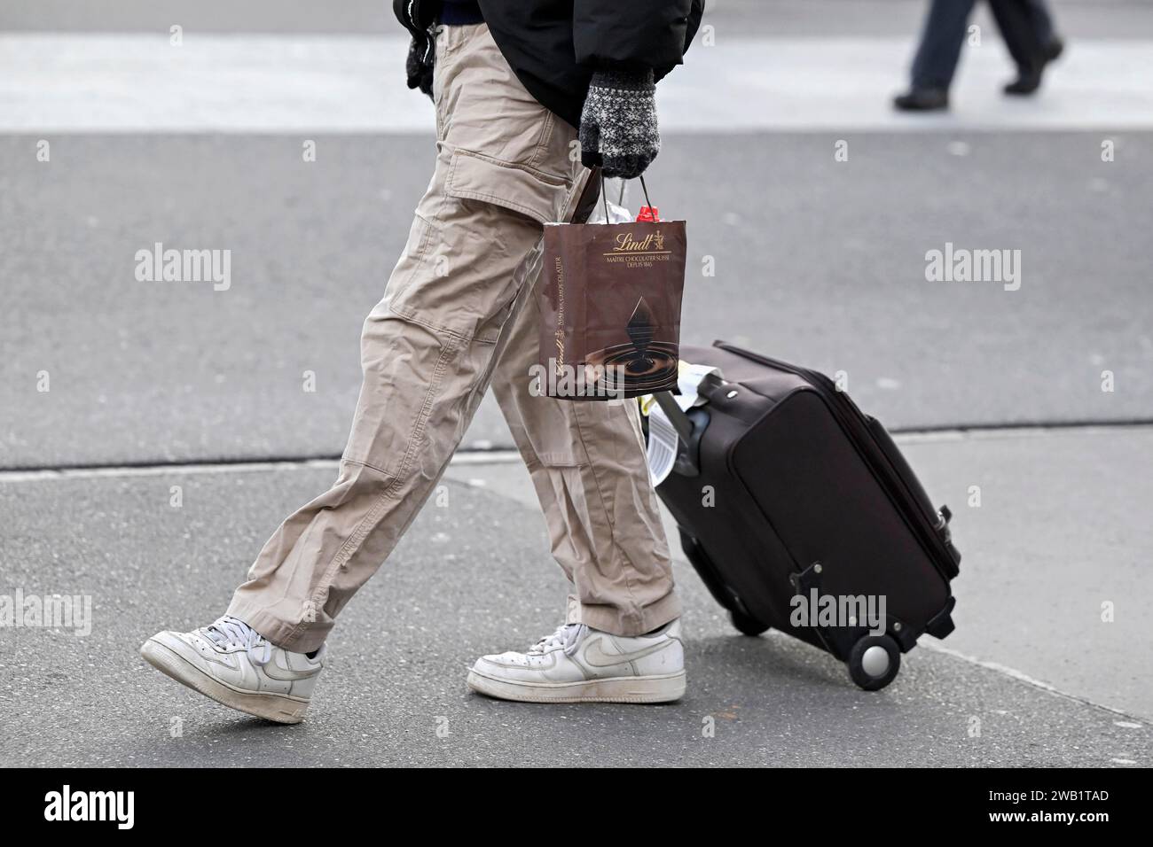 Man with trolley case Stock Photo - Alamy