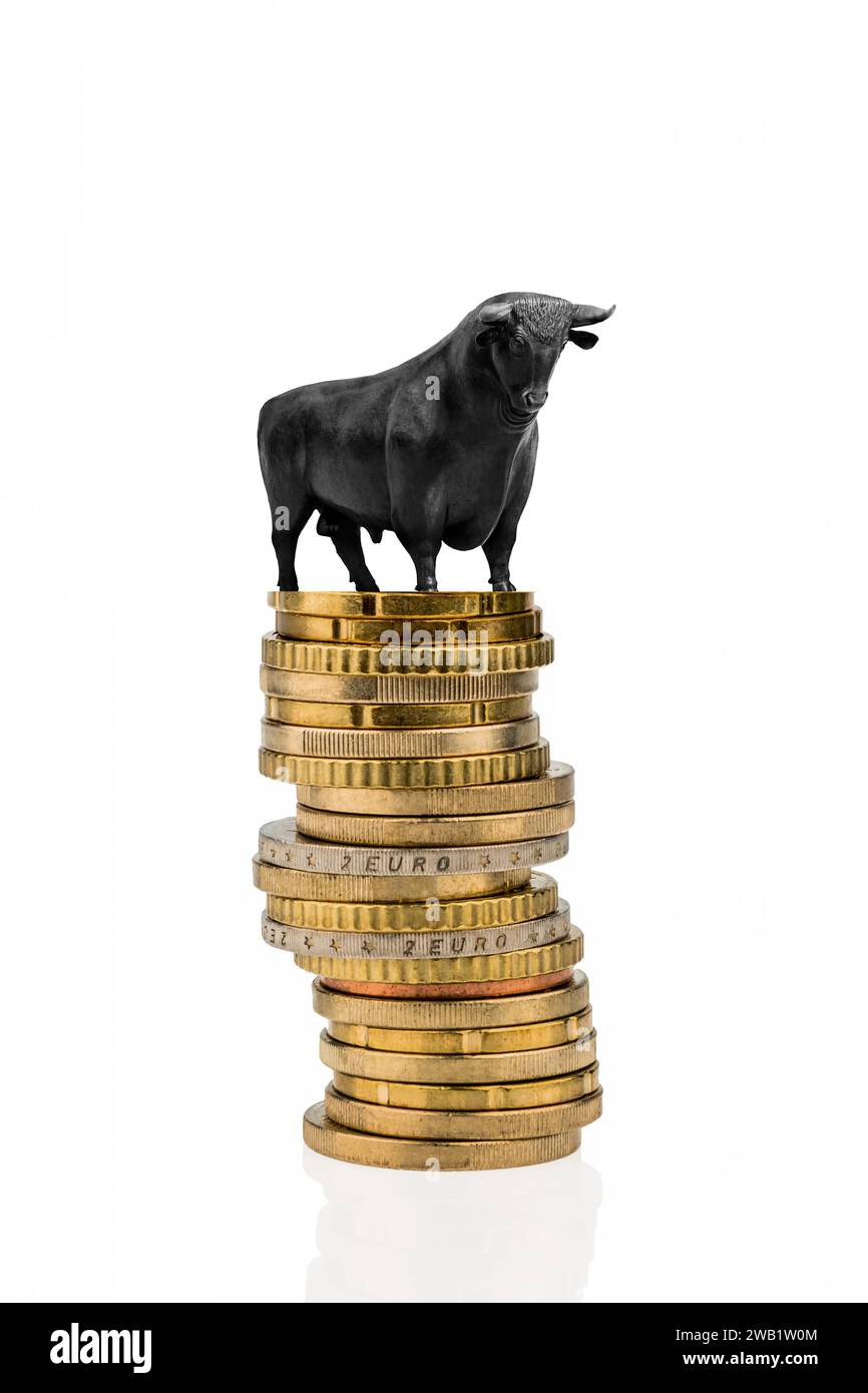 Bull stands on stacks of money, rising stock market prices, studio ...
