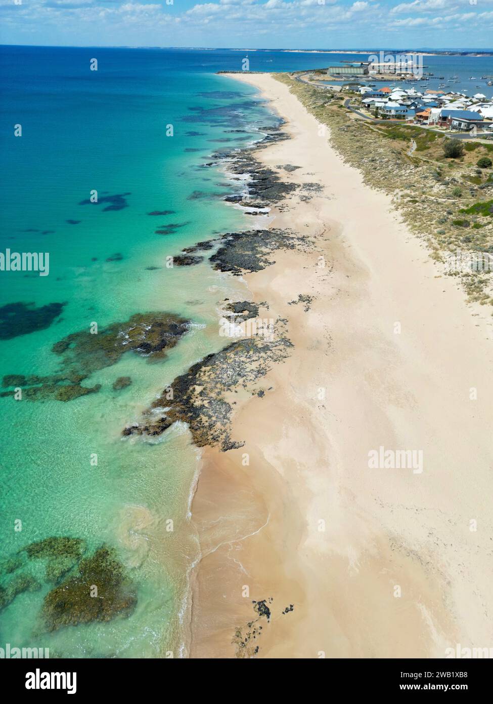 An aerial view of a tropical beach coastline with crystal clear blue ...