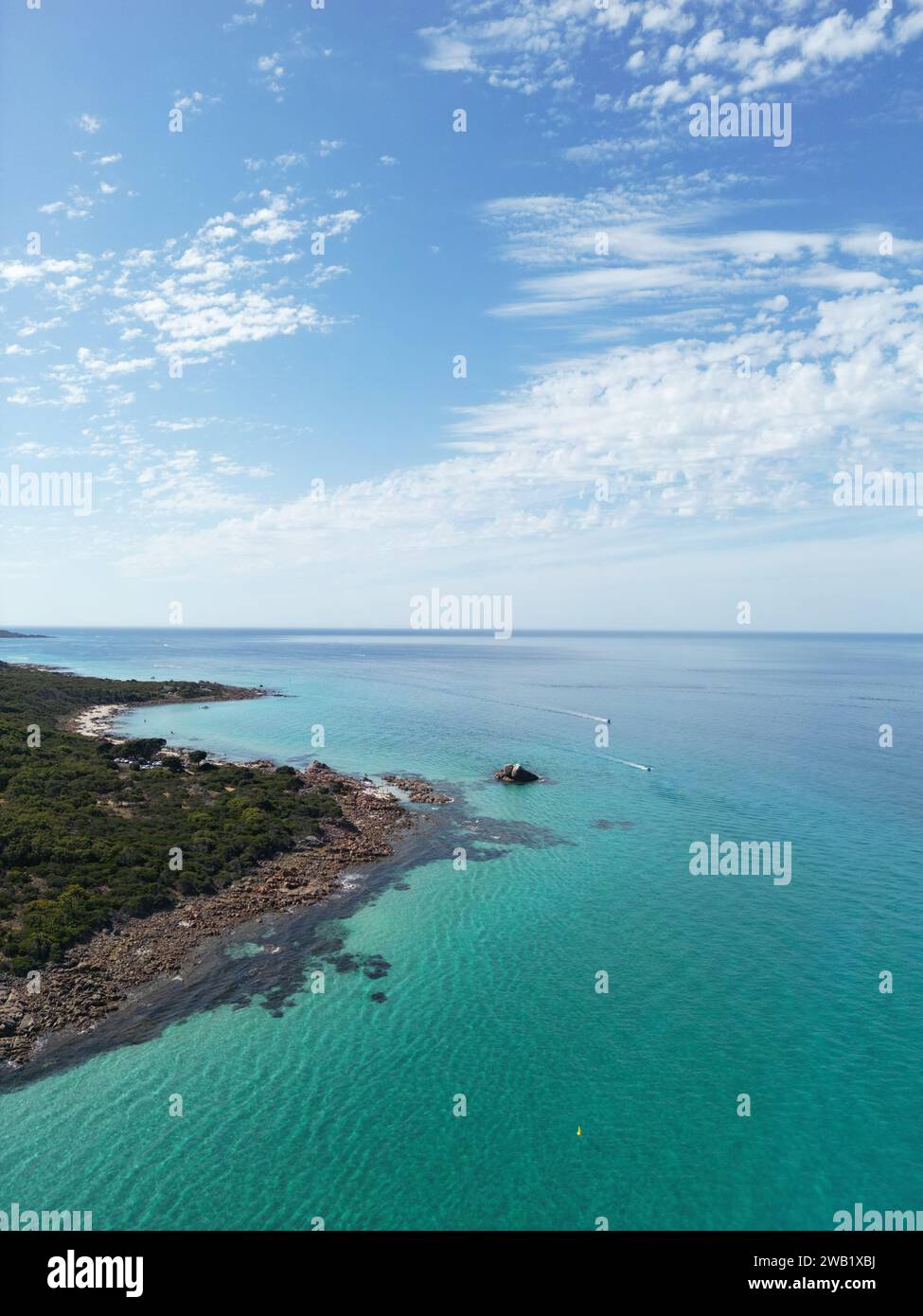 An aerial view of a tropical beach coastline with crystal clear blue ...