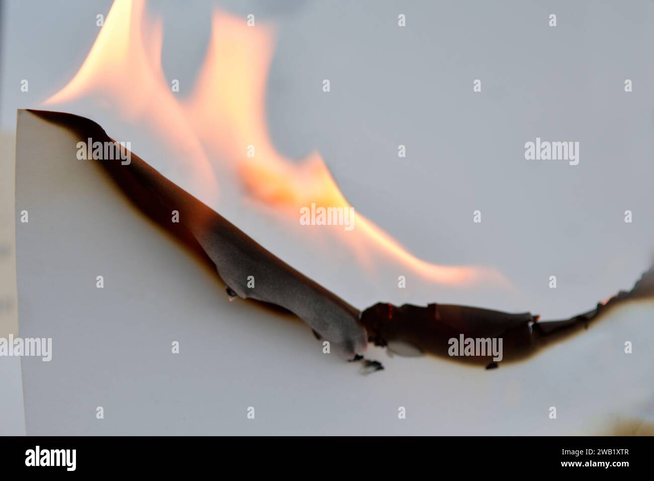 burning white paper on white background Stock Photo - Alamy