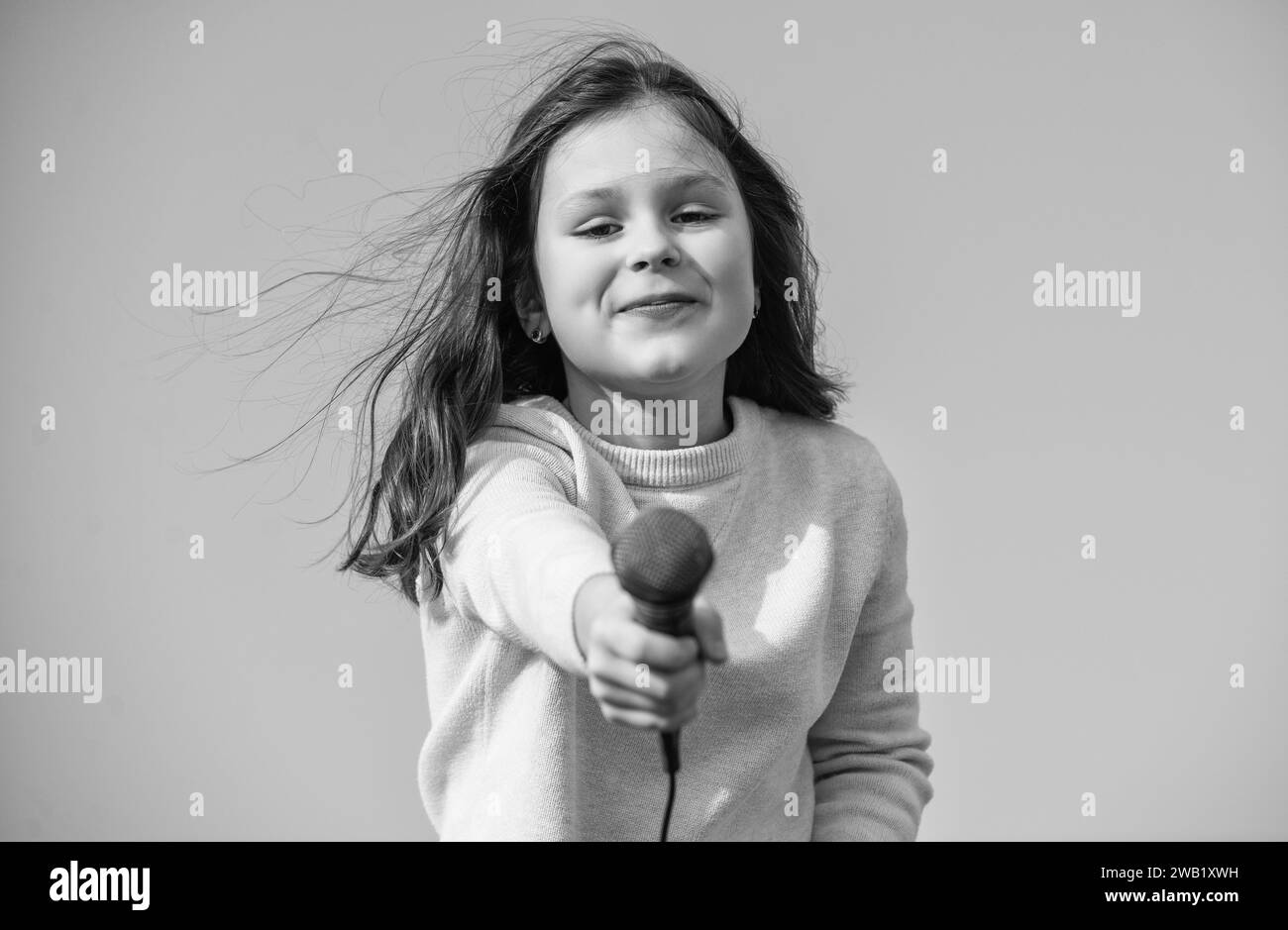 cheerful teen kid journalist interviewing with microphone Stock Photo ...