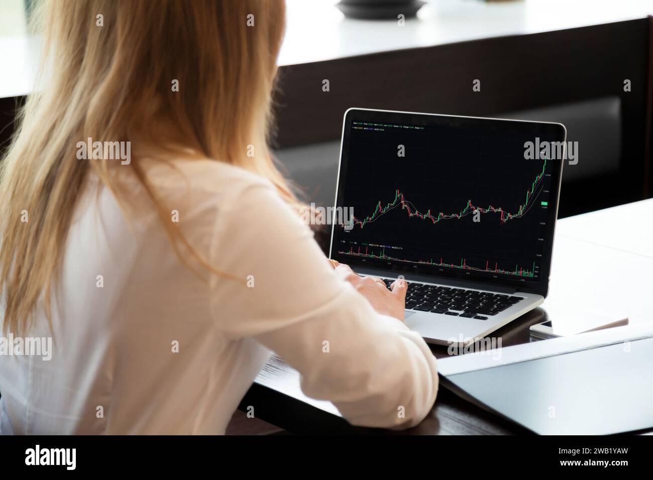 Female investor using stock market hi-res stock photography and images ...