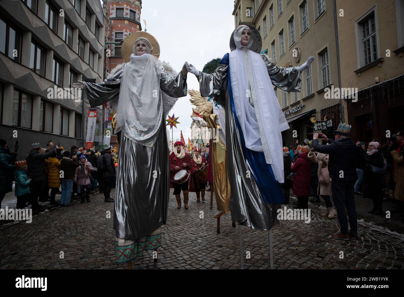 Figures of angels on stilts take part in the Procession of the Three ...