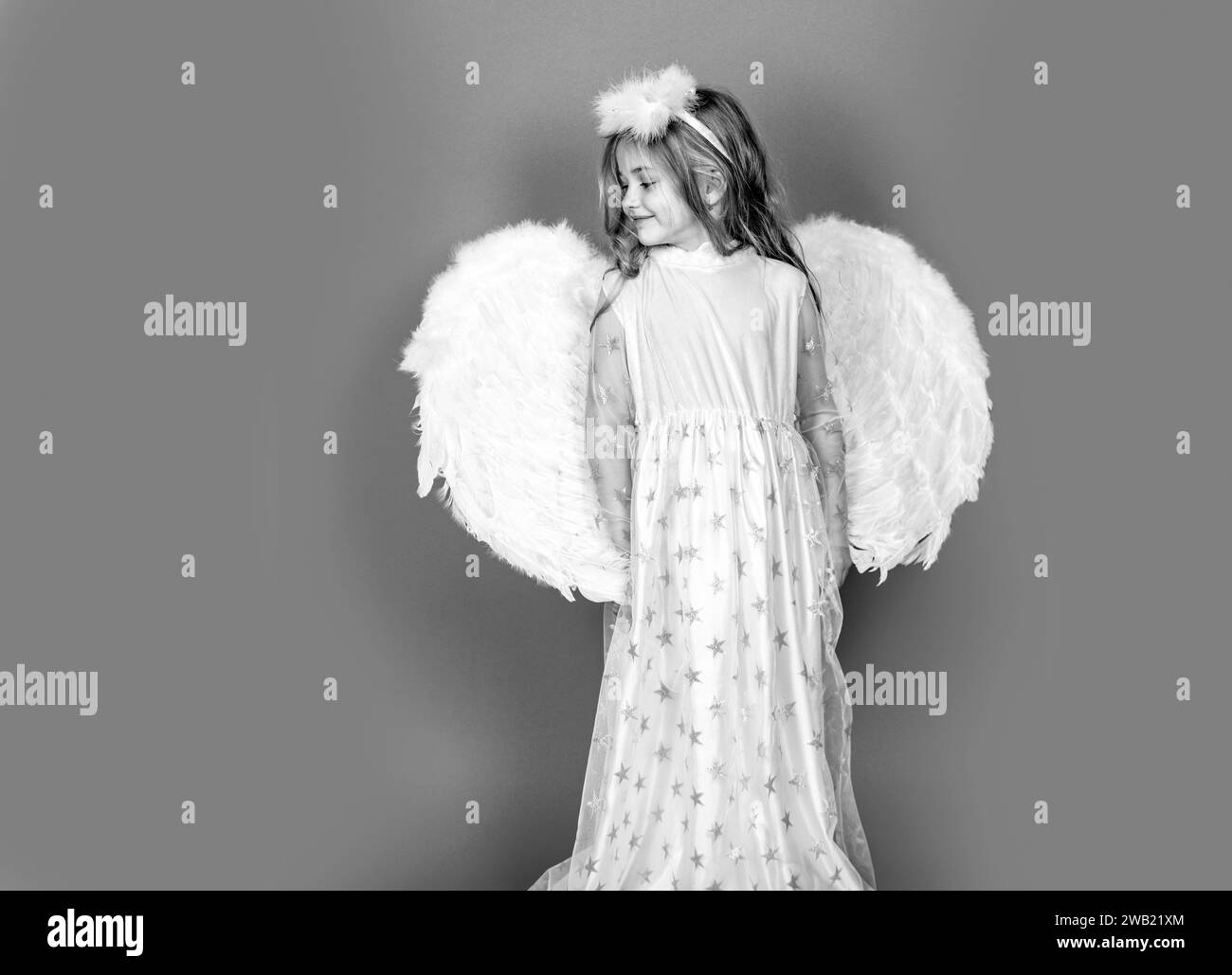 Angel child girl with white wings and angels halo, valentines day ...
