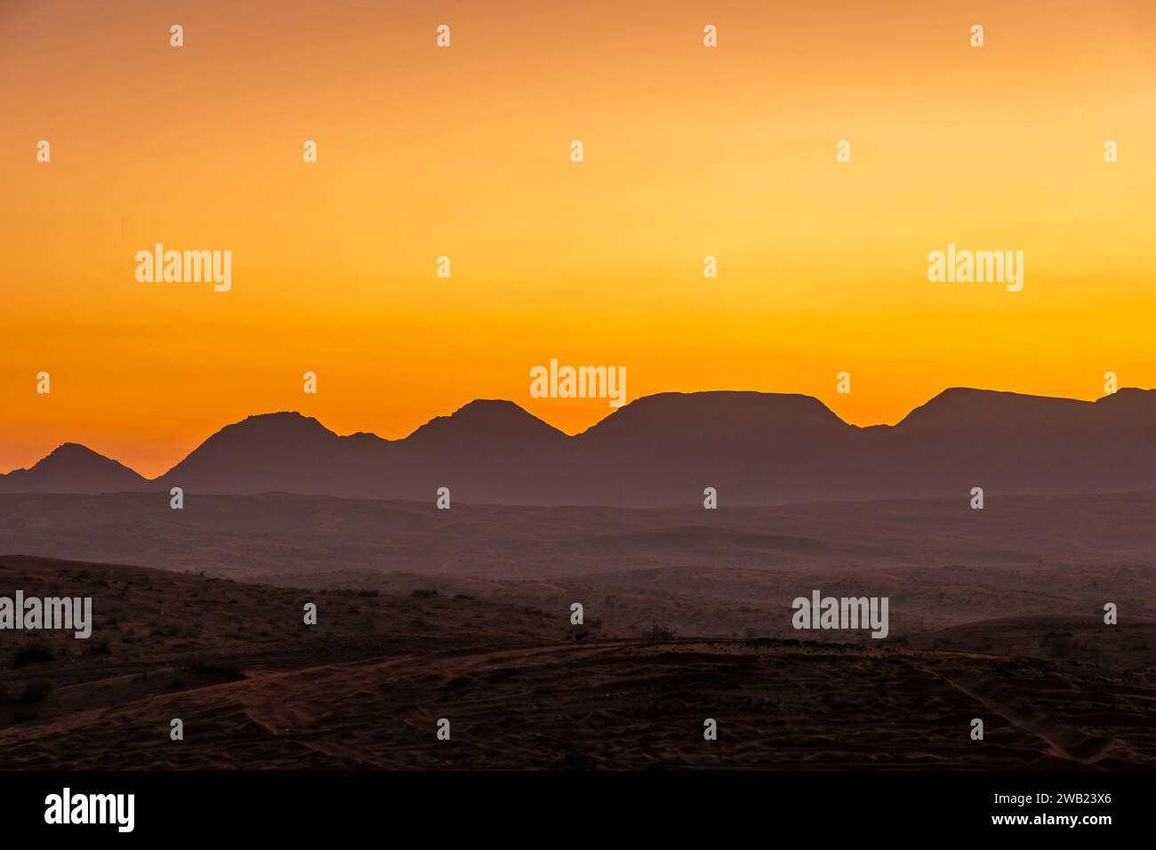 Breathtaking view of golden hour sunrise from Dubai Maleha desert with ...