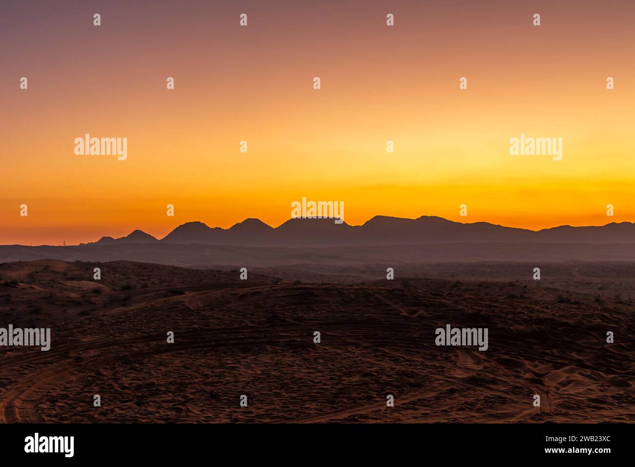 Breathtaking view of golden hour sunrise from Dubai Maleha desert with ...