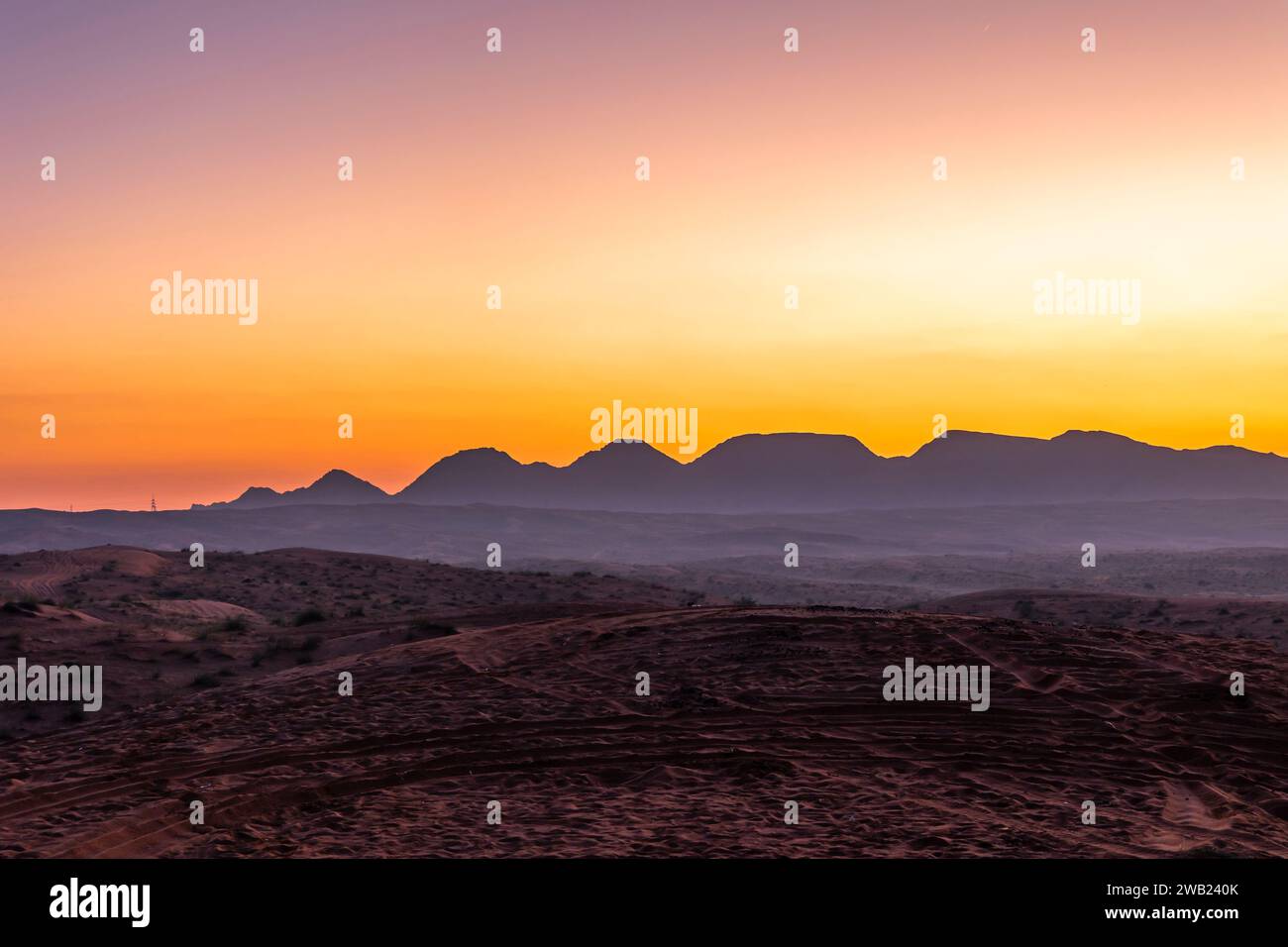 Breathtaking view of golden hour sunrise from Dubai Maleha desert with ...