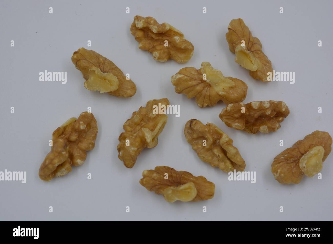 Healthy food, natural nuts, walnuts arranged on a white background ...