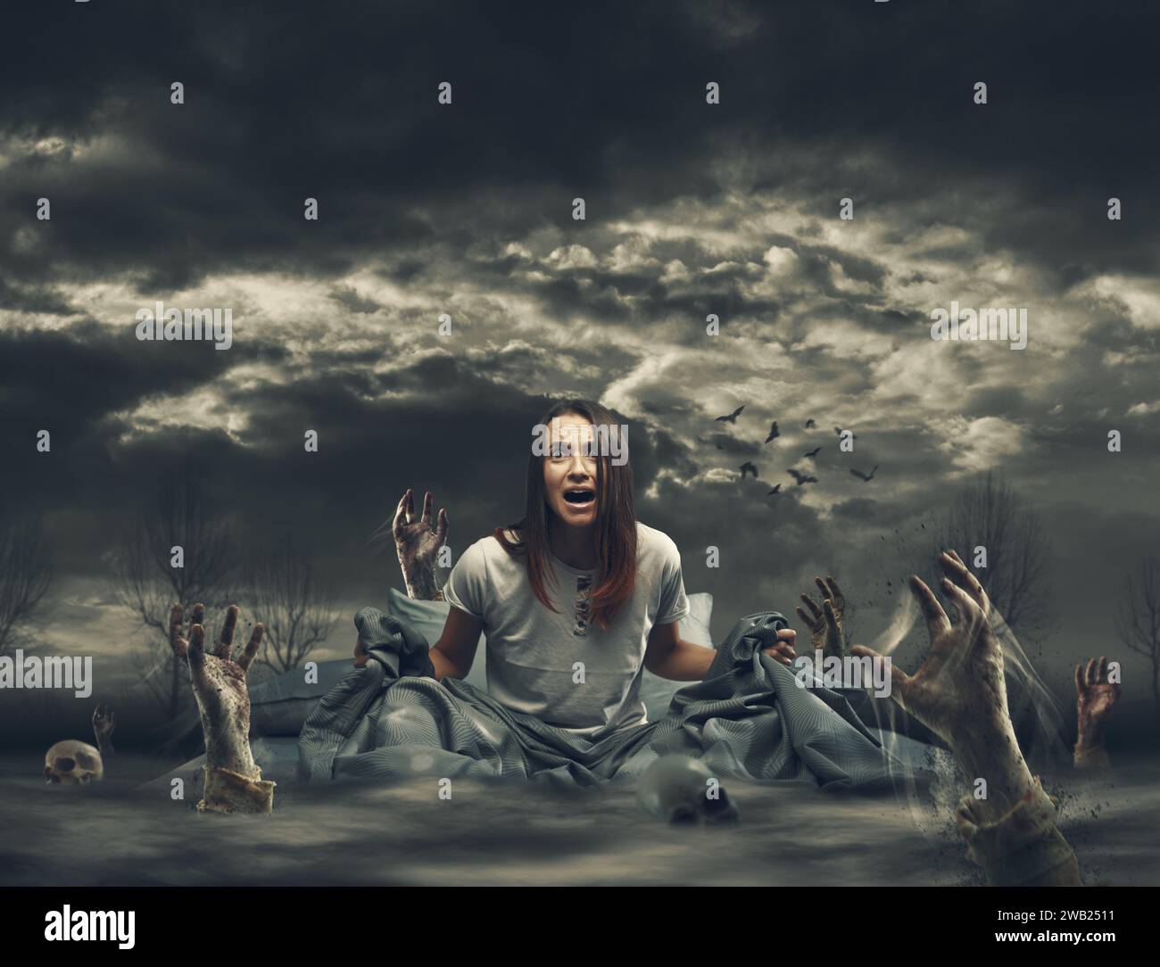 Terrified young woman in her bed surrounded by zombies, horror and ...