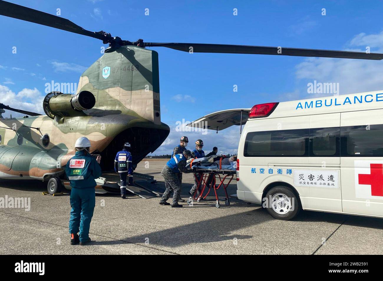 In this photo provided by Japanese Ministry of Defense, members of ...