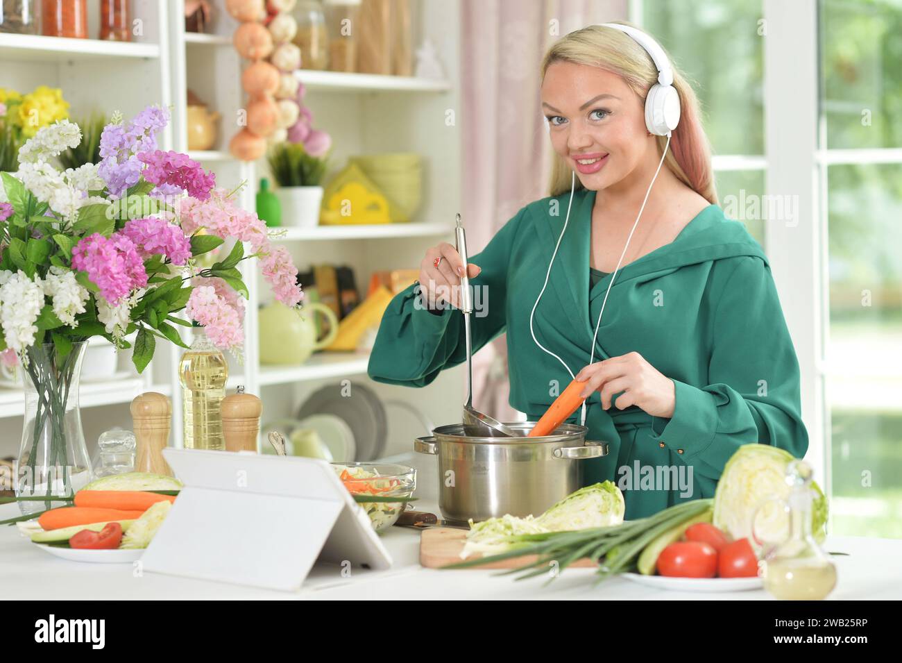 beautiful emotional young woman cooking in kitchen Stock Photo - Alamy