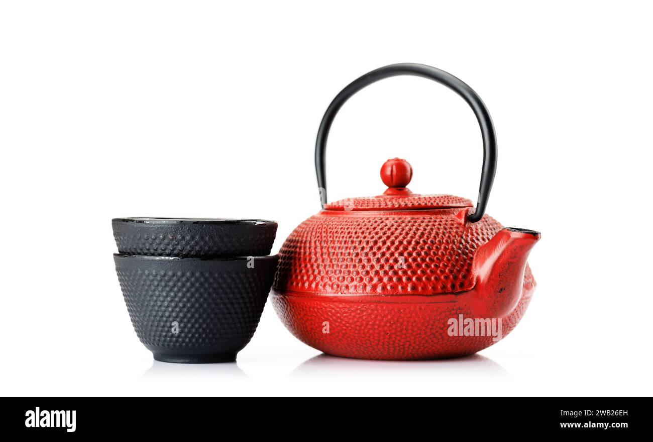 Iron teapot and cups. Isolated on white background Stock Photo - Alamy